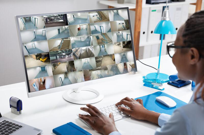 businesswoman-checking-cctv-camera-footage-computer-young-businesswoman ...